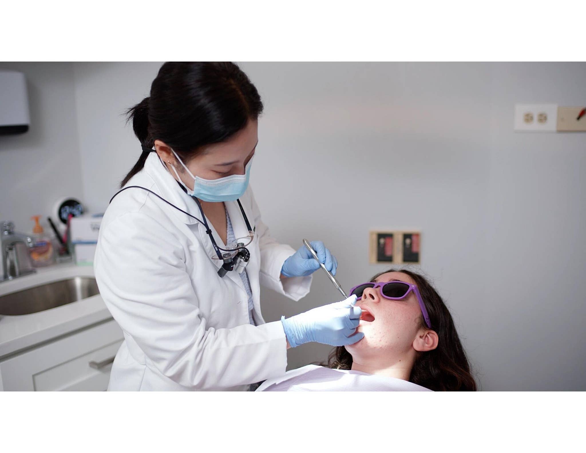 Alexandria dentist Dr. Irene Shin working on dental implants by U Shine ...